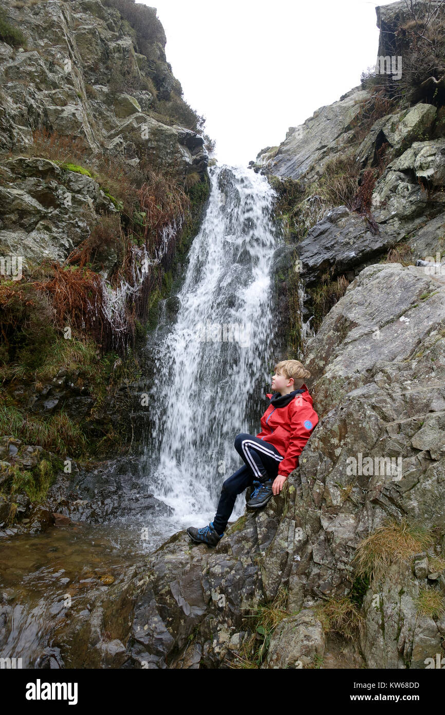 Young boy child walking near waterfall on the Long Mynd hill in ...