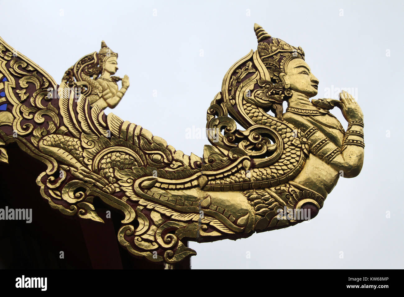 Golden creatures on the roof of buddhist temple, Thailand Stock Photo ...