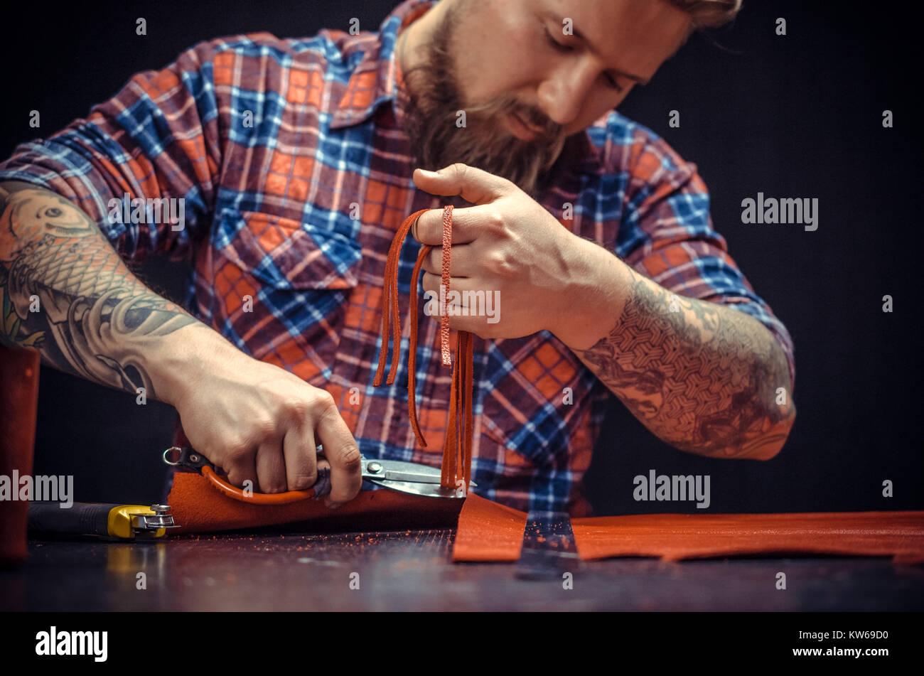 Professional Tanner working with leatherwork Stock Photo - Alamy