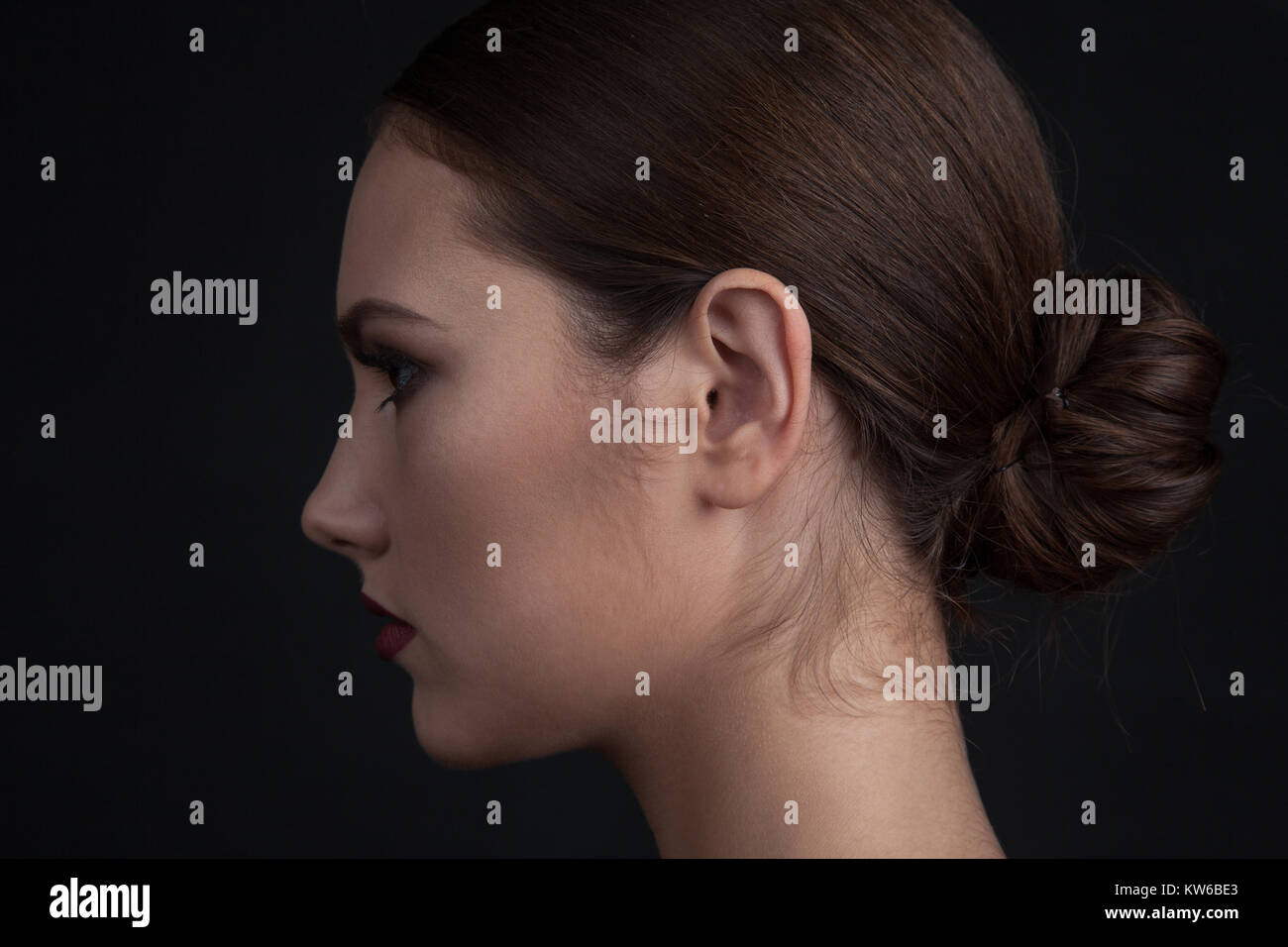Profile of a woman's face with makeup on a black background Stock Photo ...