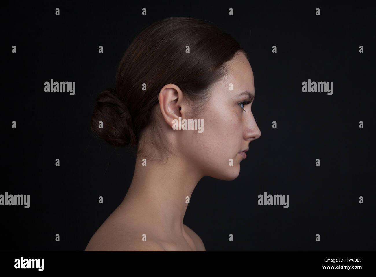 Profile of a woman's face without makeup on a black background Stock ...