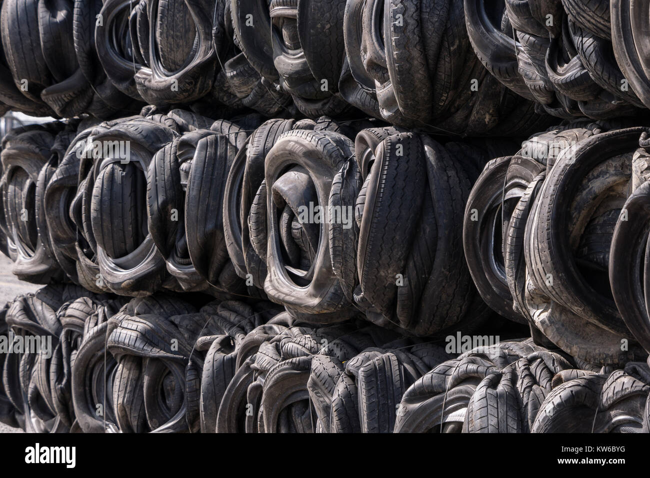 Bale of worn vehicle tryes ready for recycling Stock Photo - Alamy