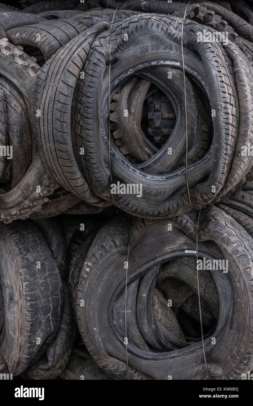 Bale of worn vehicle tryes ready for recycling Stock Photo - Alamy