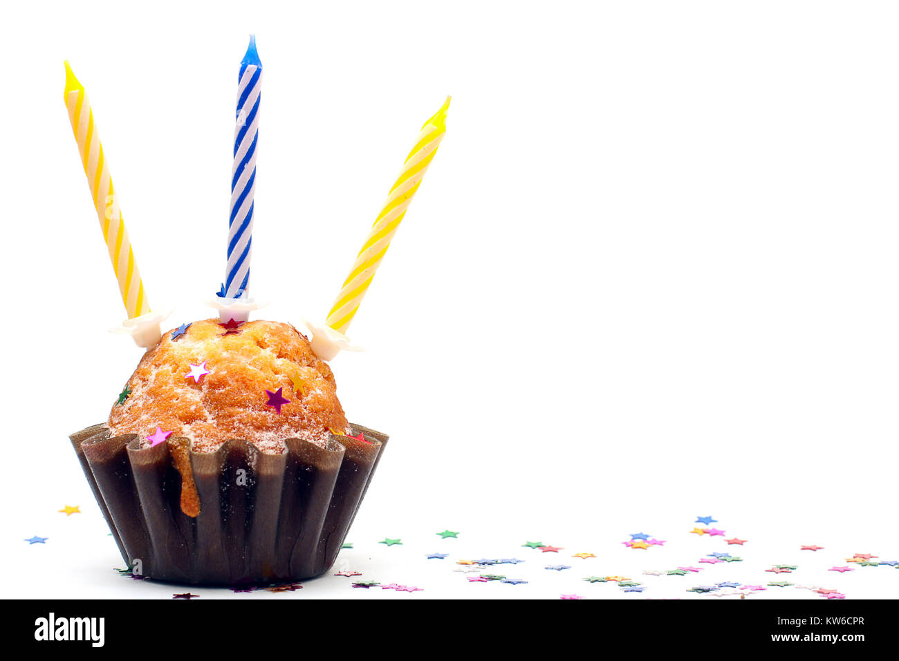 Birthday cupcake with three candles isolated on white Stock Photo - Alamy