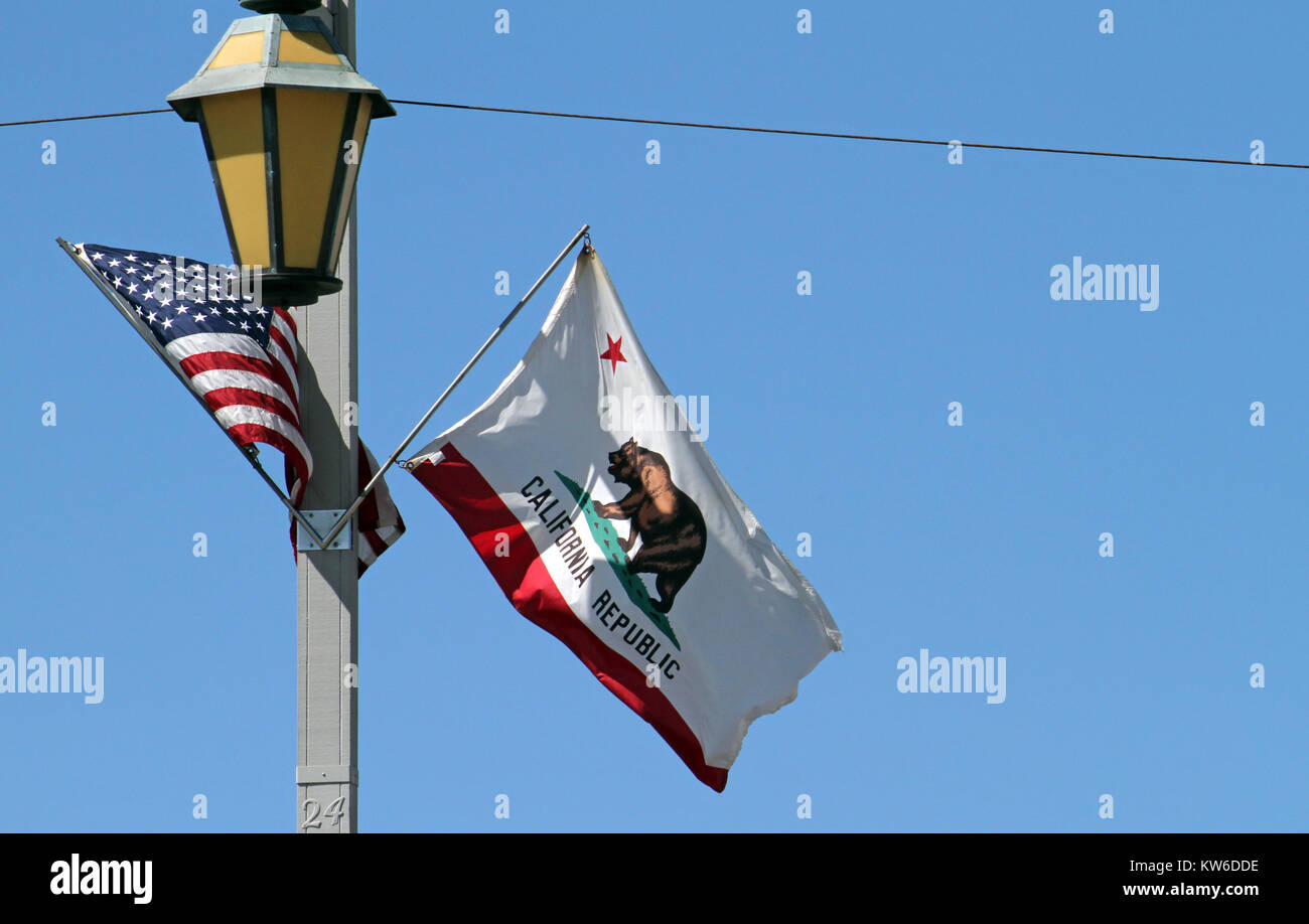 American and Californian flags on lamp post in San Francisco ...