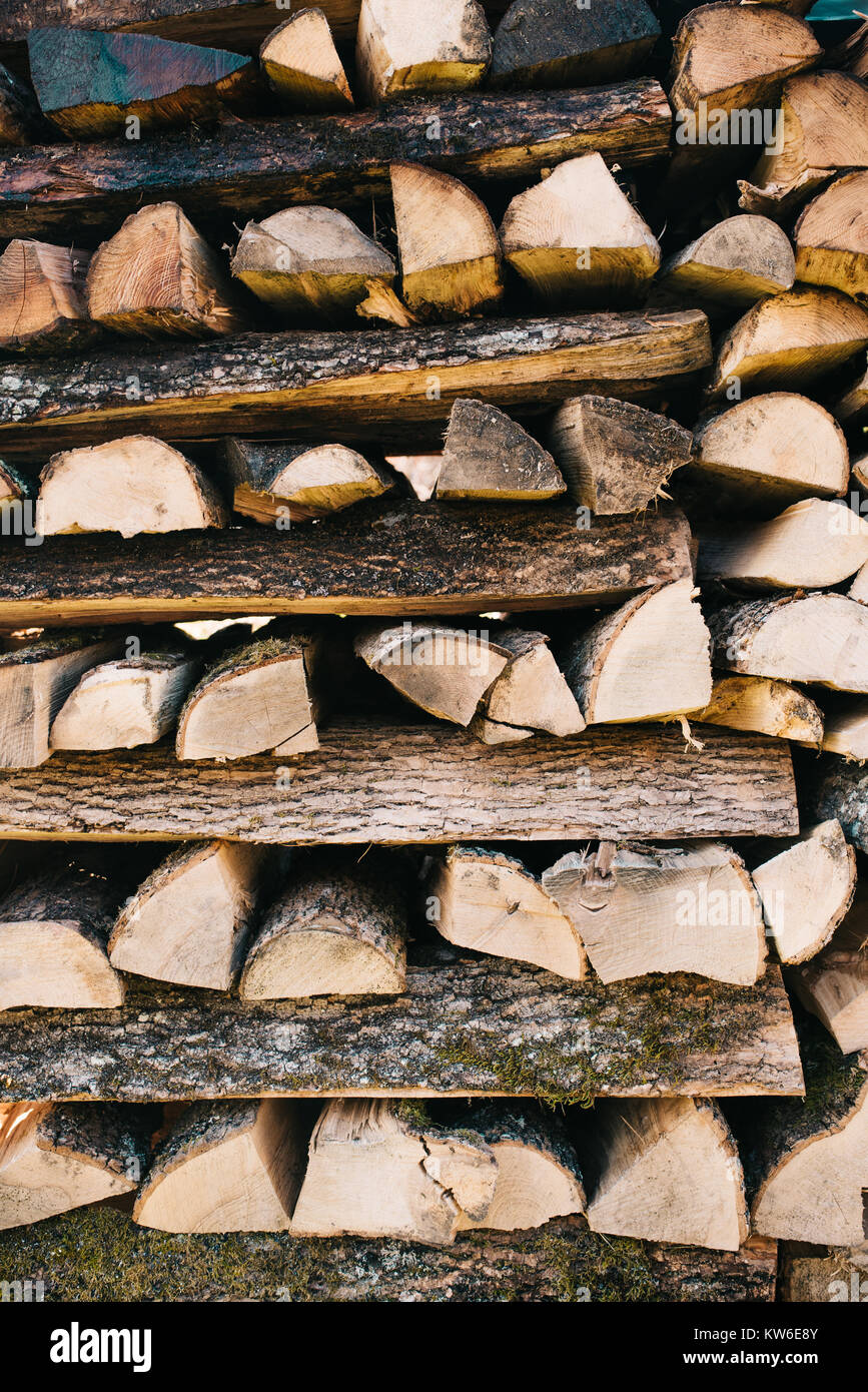 Stacked firewood background Stock Photo - Alamy