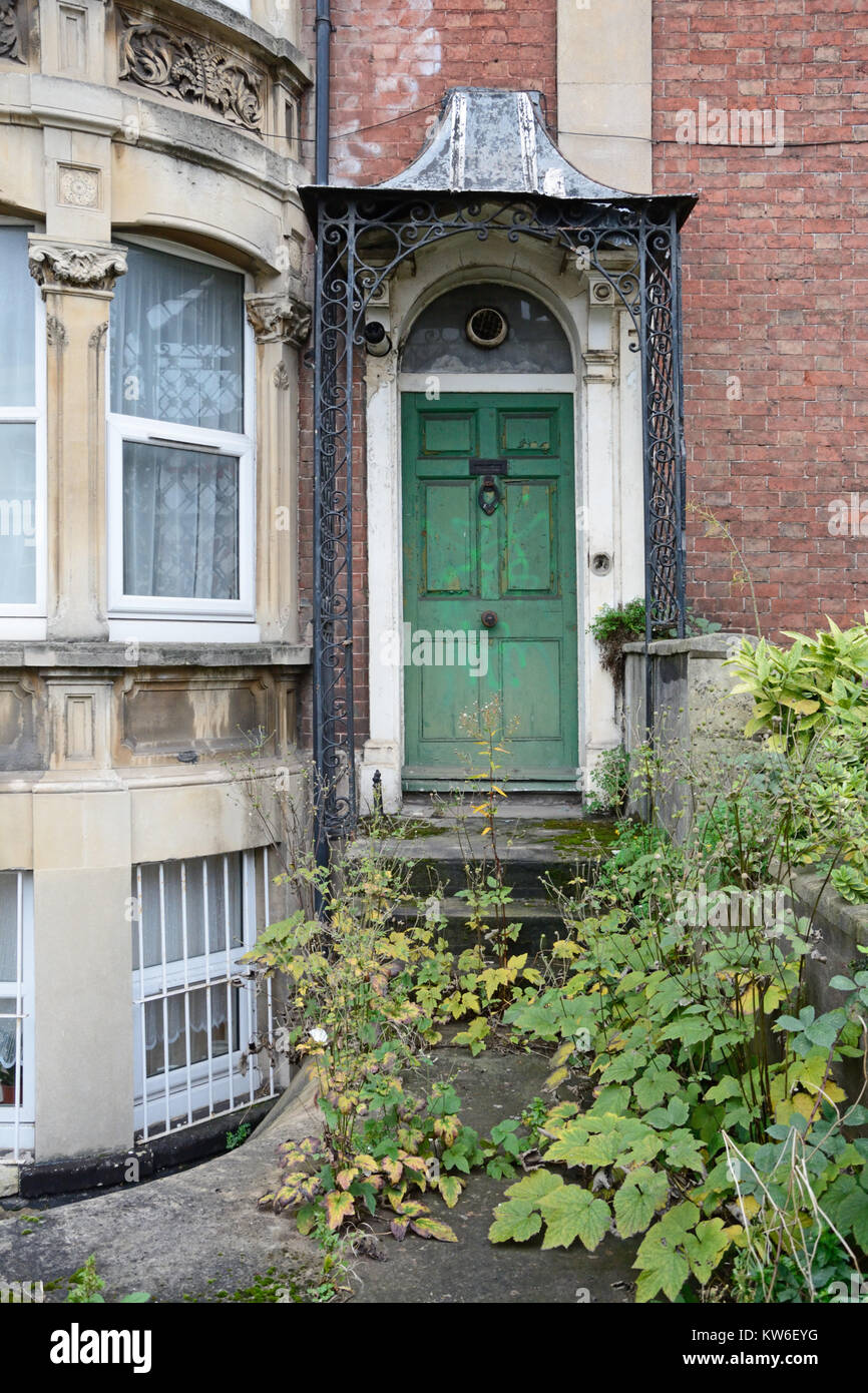 Green door, & overgrown garden, Bristol Stock Photo - Alamy