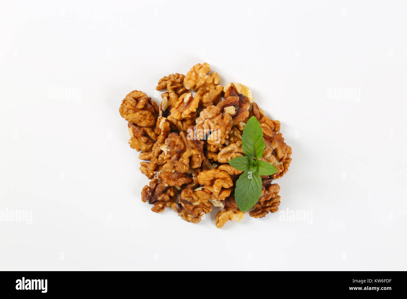 pile of peeled walnuts on white background Stock Photo - Alamy
