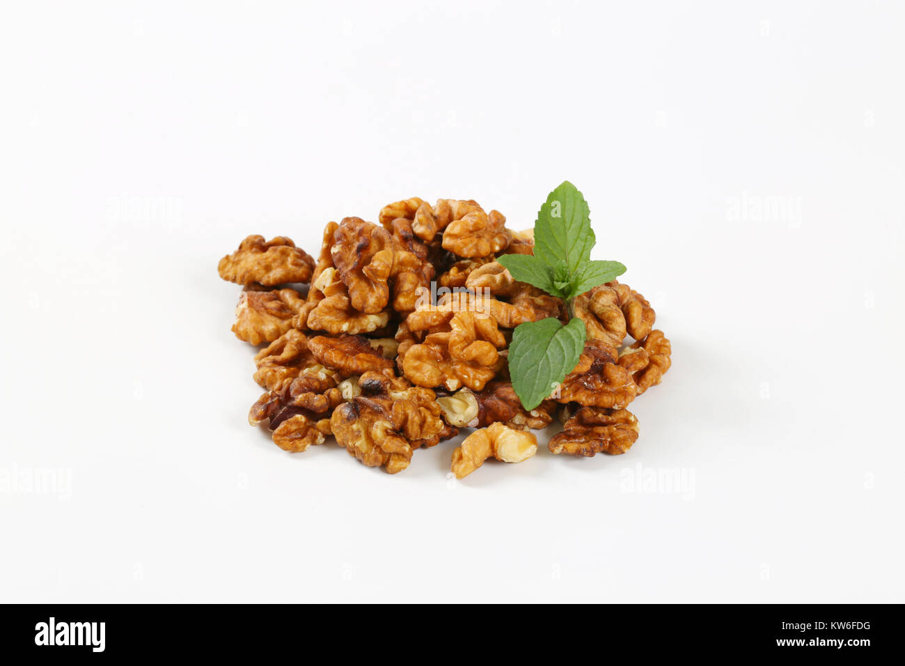 pile of peeled walnuts on white background Stock Photo - Alamy