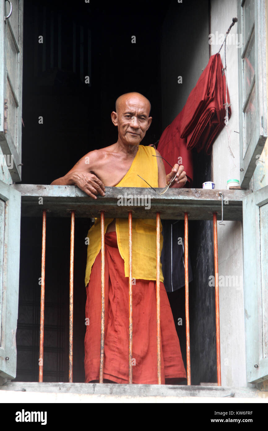 Buddhist monk on the balcony of monastery in Yangon, Myanmar Stock ...