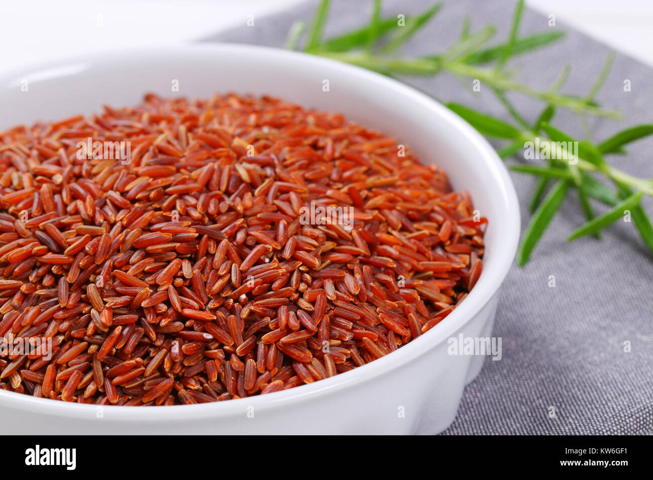 bowl of red rice on grey place mat - close up Stock Photo - Alamy