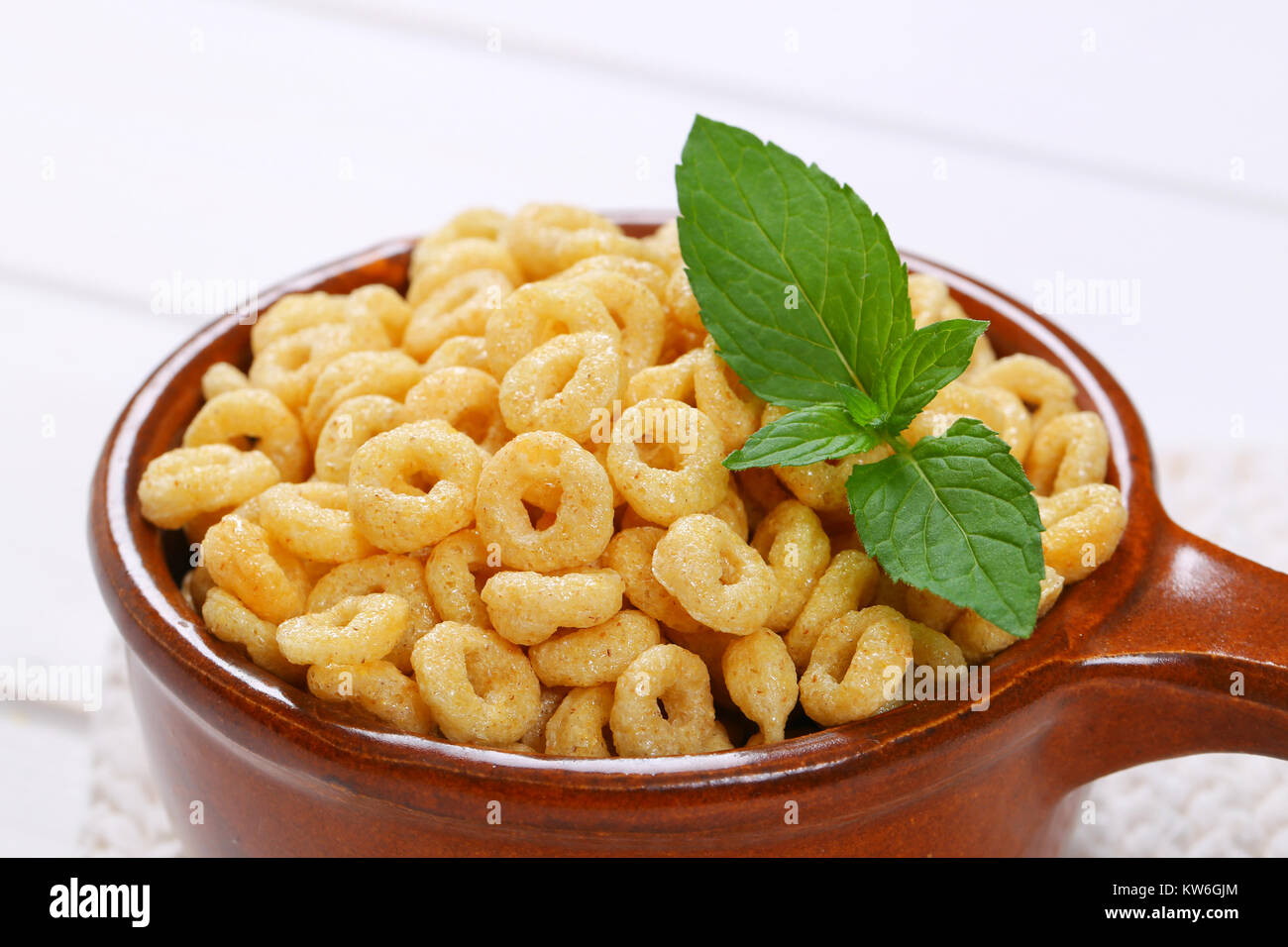 saucepan of honey cereal rings - close up Stock Photo - Alamy