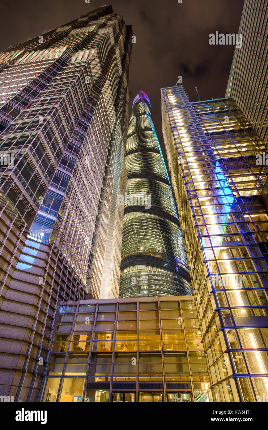 Skyscrapers at Night - A close-up low-angle night view of glittering ...