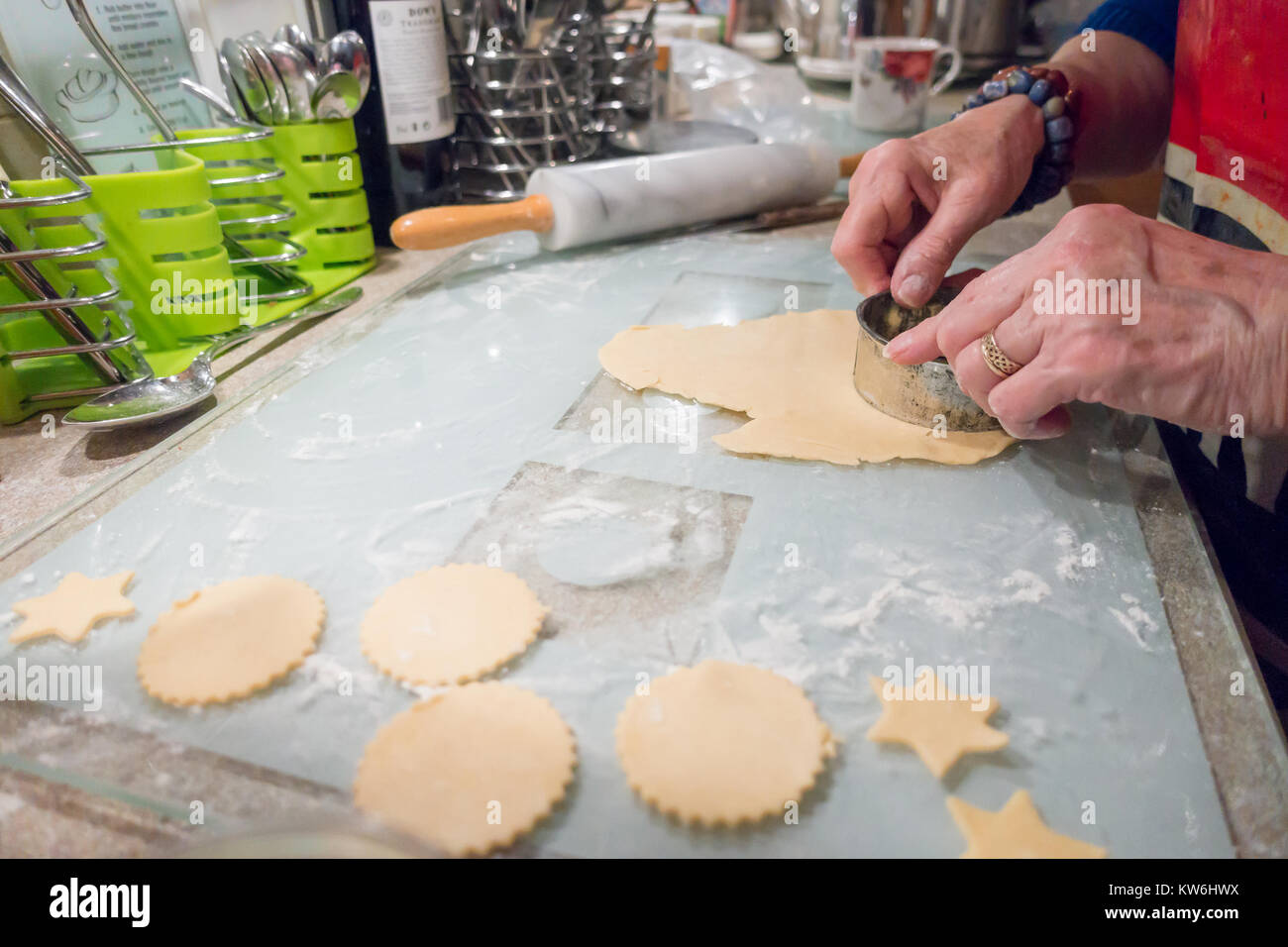 Making Mince Pies: Cutting shapes out of rolled shortcrust pastry on a ...
