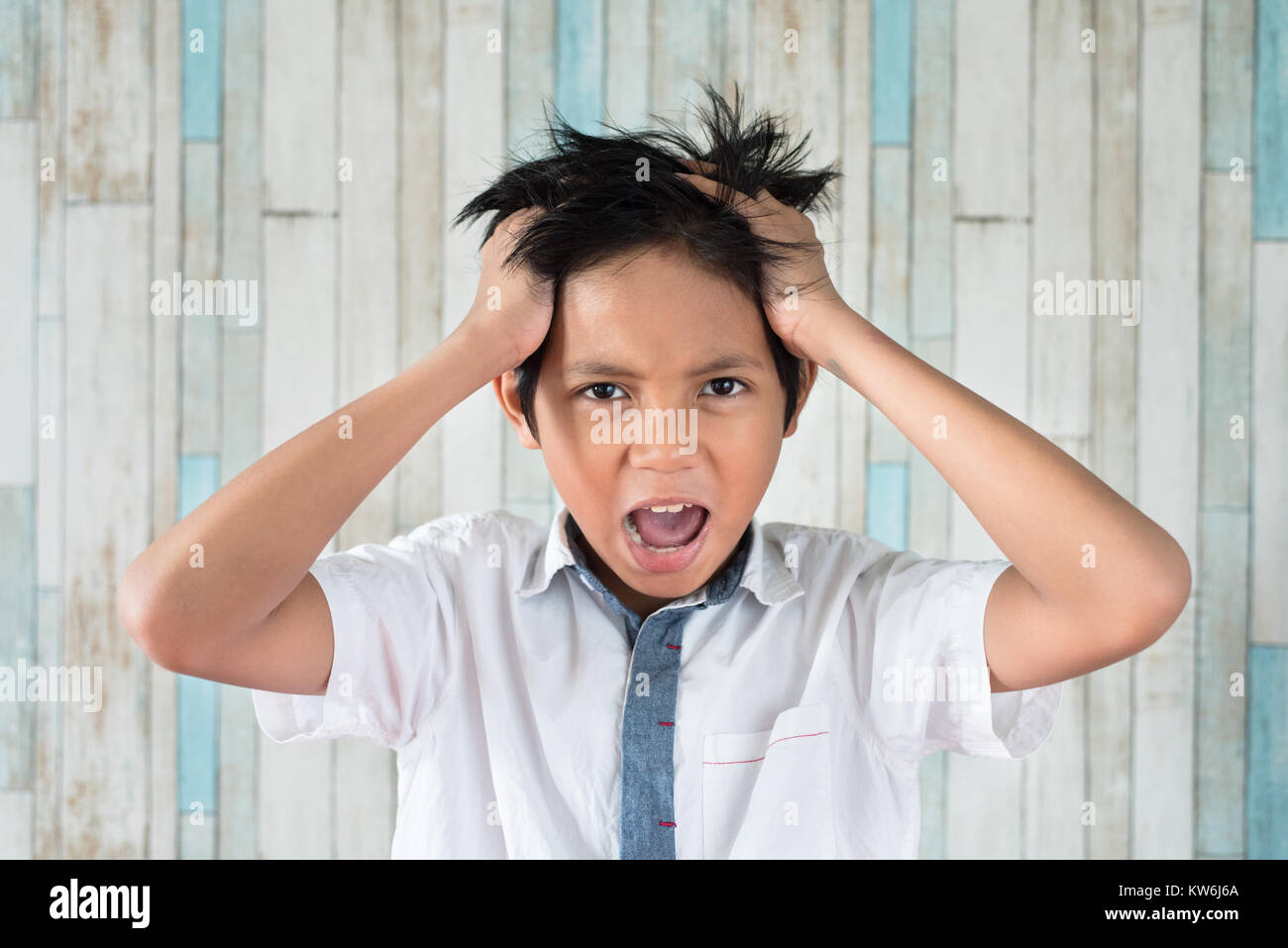 asian boy holding his head feeling stress. problem concept Stock Photo ...