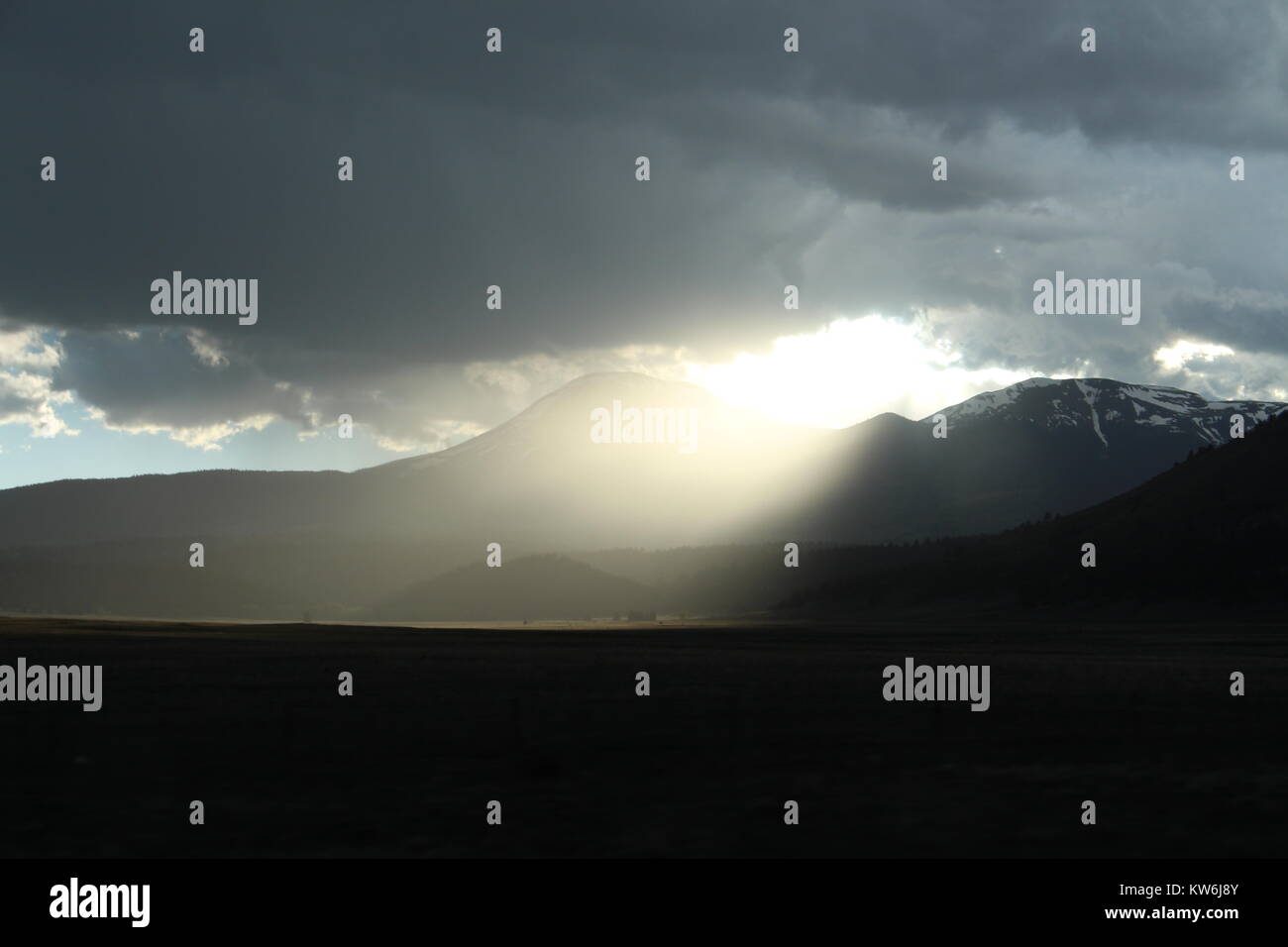 Sun coming out from the clouds Stock Photo - Alamy