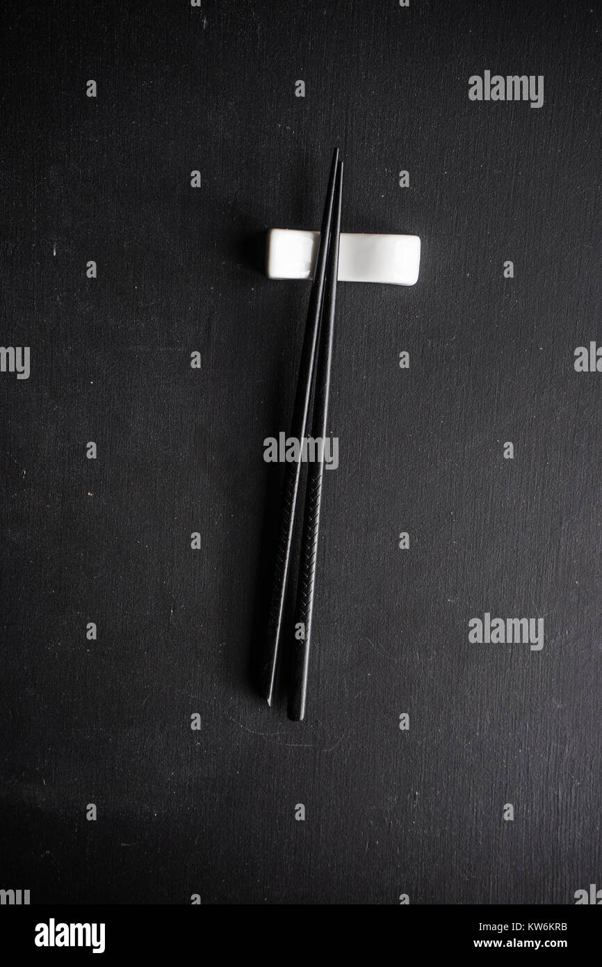 Rustic table set with chopsticks for festive dinner in asian style ...