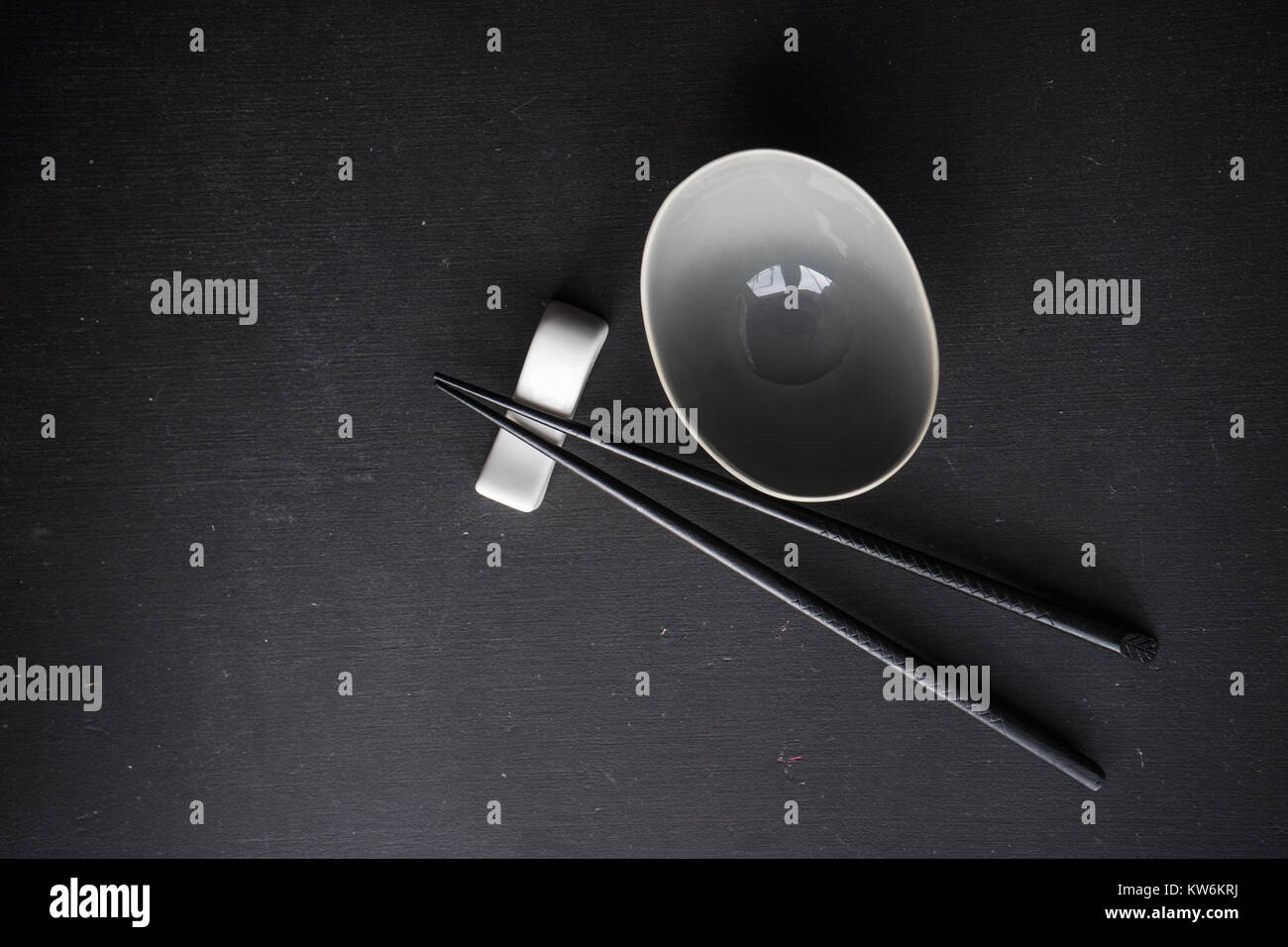 Rustic table set with chopsticks for festive dinner in asian style ...