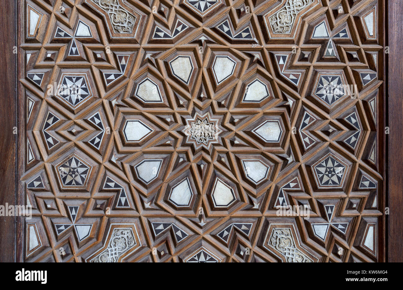 Closeup of arabesque ornaments of an old aged decorated wooden door ...