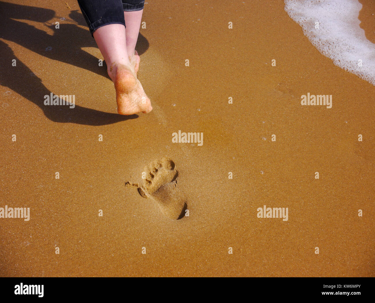 Footprints in the sand Stock Photo - Alamy