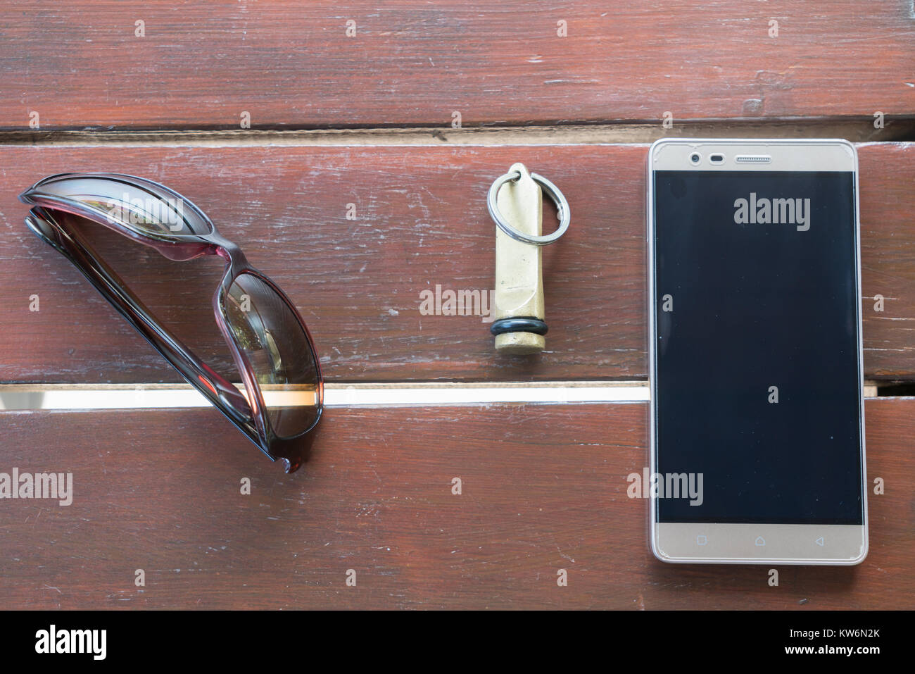 Sunglasses Mobile Phone Hotel Key Chain on Wooden Table Bozcaada ...