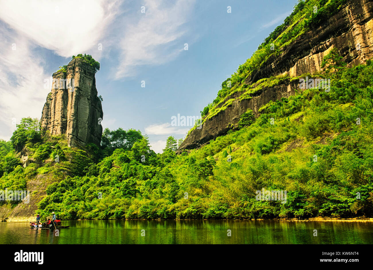 A rock cliff lining the nine bend river or Jiuxi in Wuyishan or Mount ...