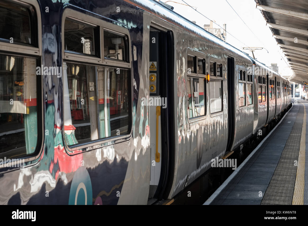 commuter train at platform, doors open Stock Photo - Alamy