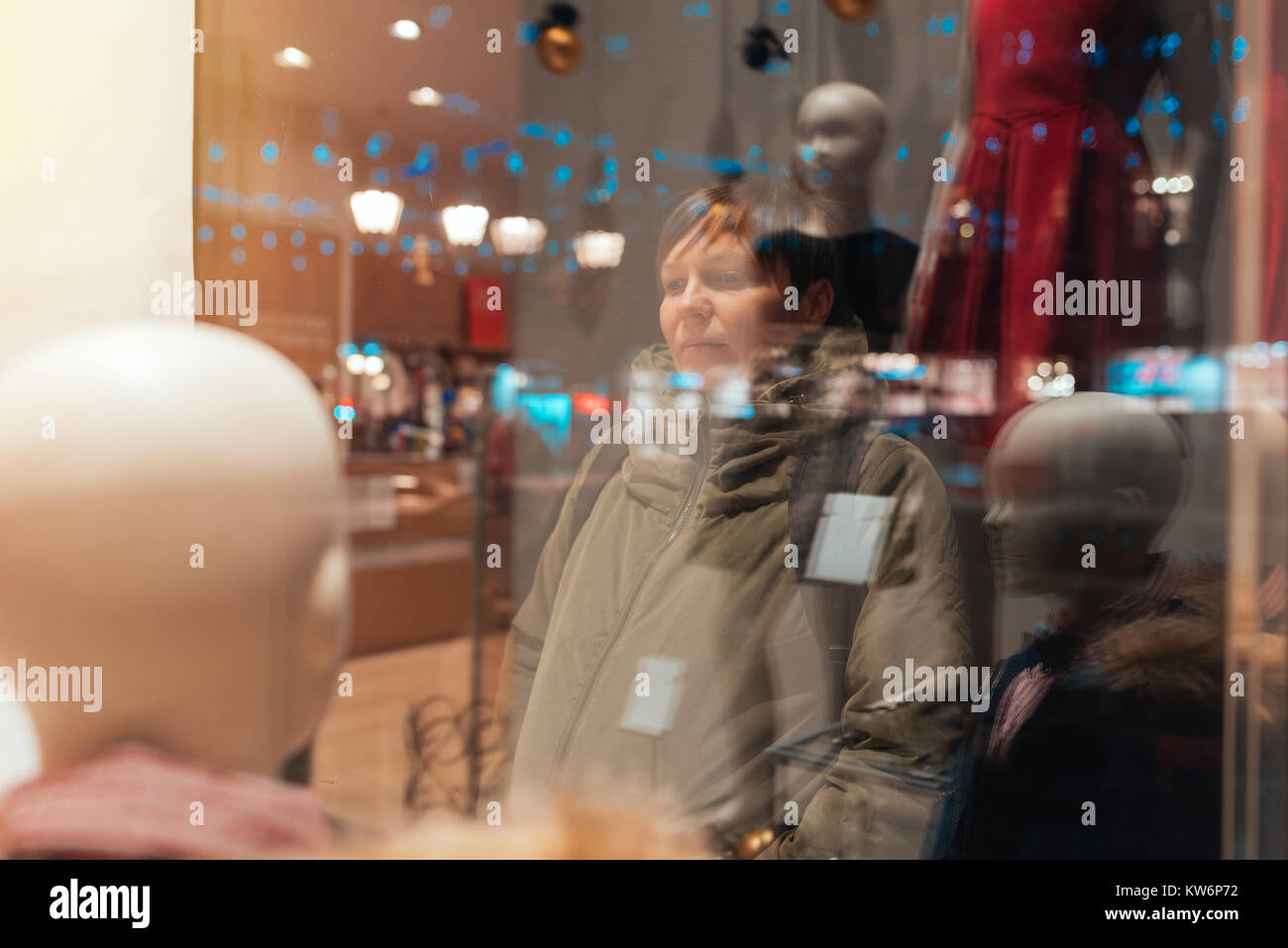 People through window night hi-res stock photography and images - Alamy