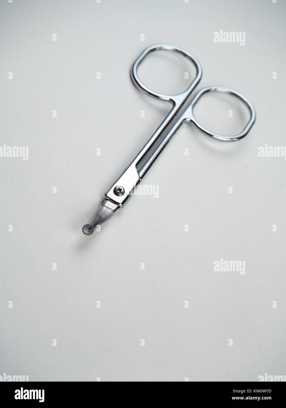 Nail scissors on white background Stock Photo - Alamy