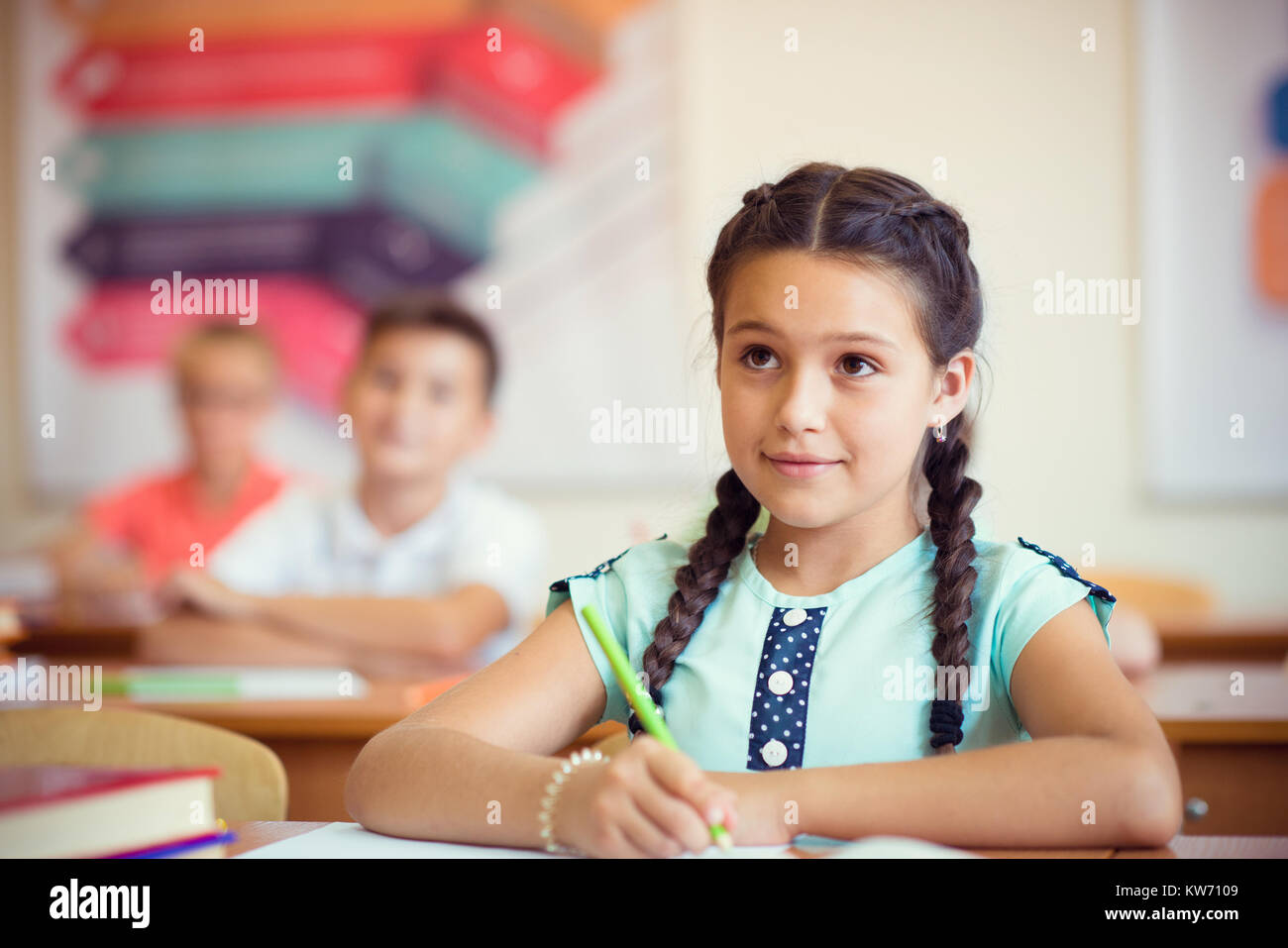 Happy clever children learning in classroom and having fun Stock Photo ...