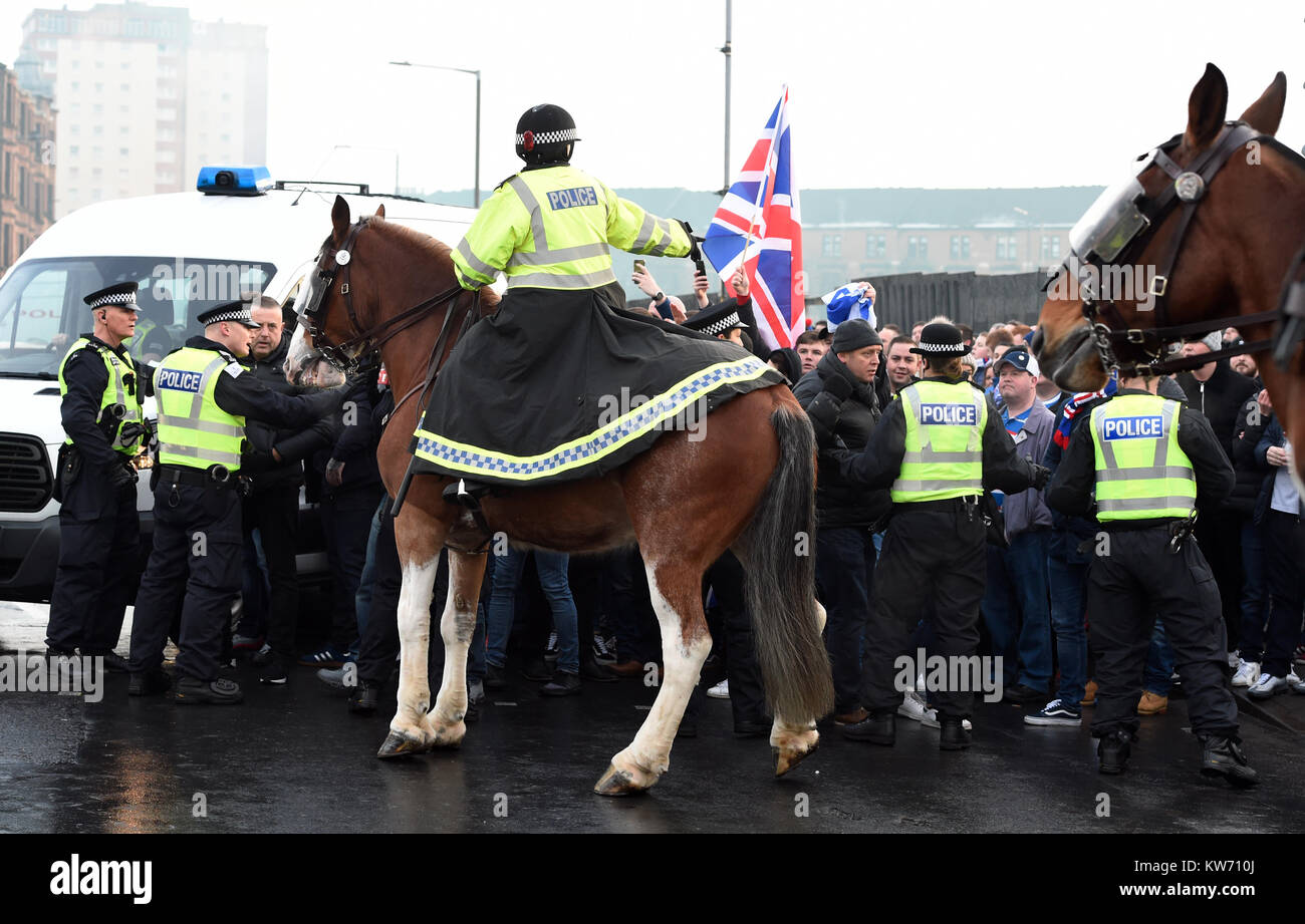 Rangers fans are escorted by police before the Scottish Premiership ...