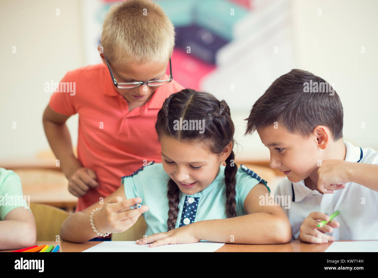 Happy group of school children learning at klassroom in school Stock ...