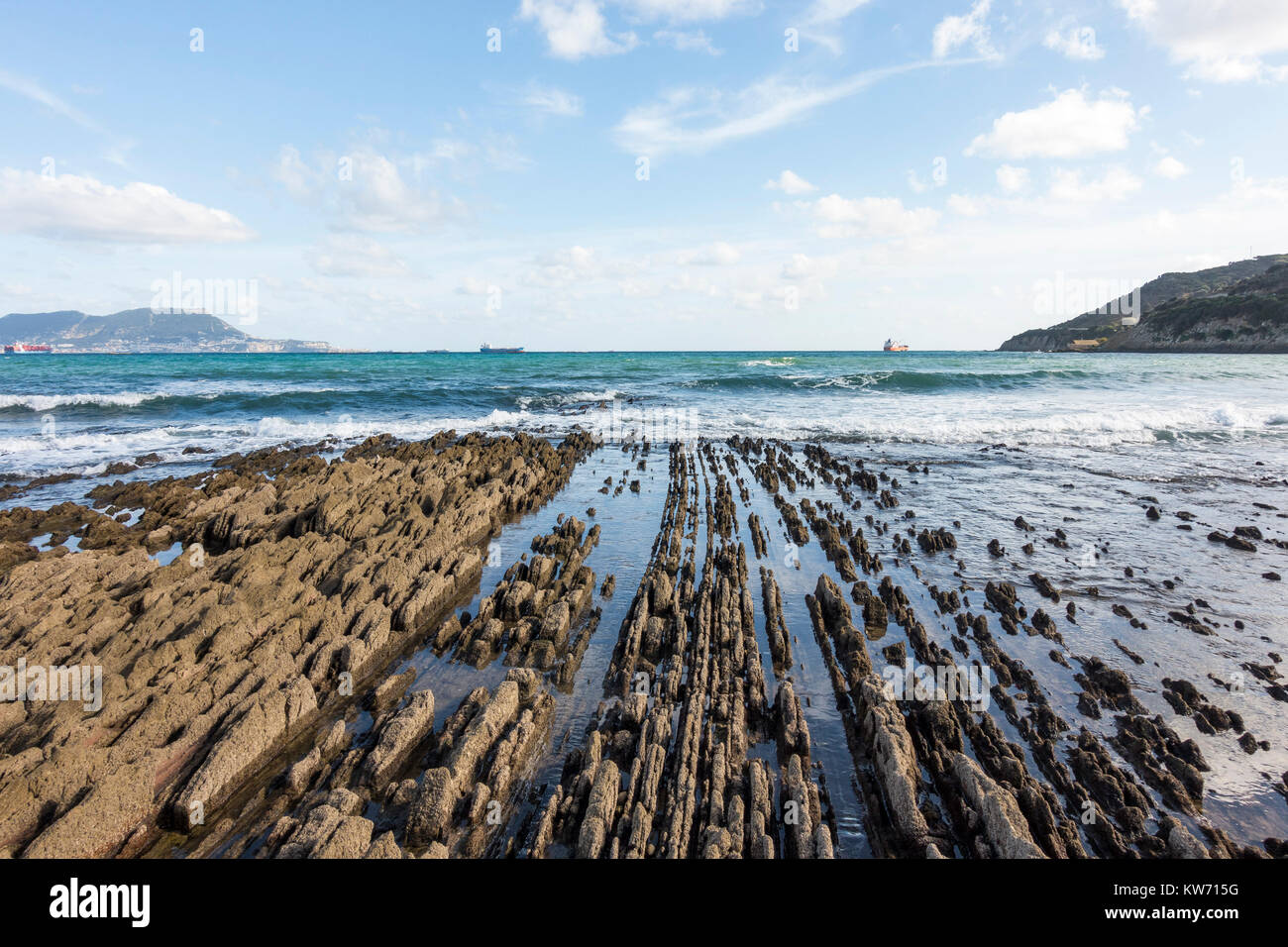 Layers of flysch on the coast at Gibraltar in background, bay of ...