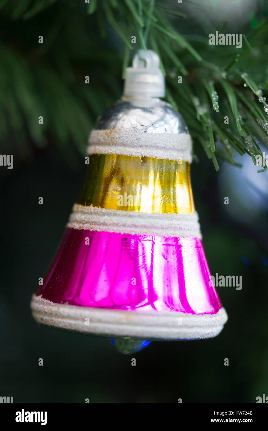 A closeup of a single decorative bell decoration hanging from a ...