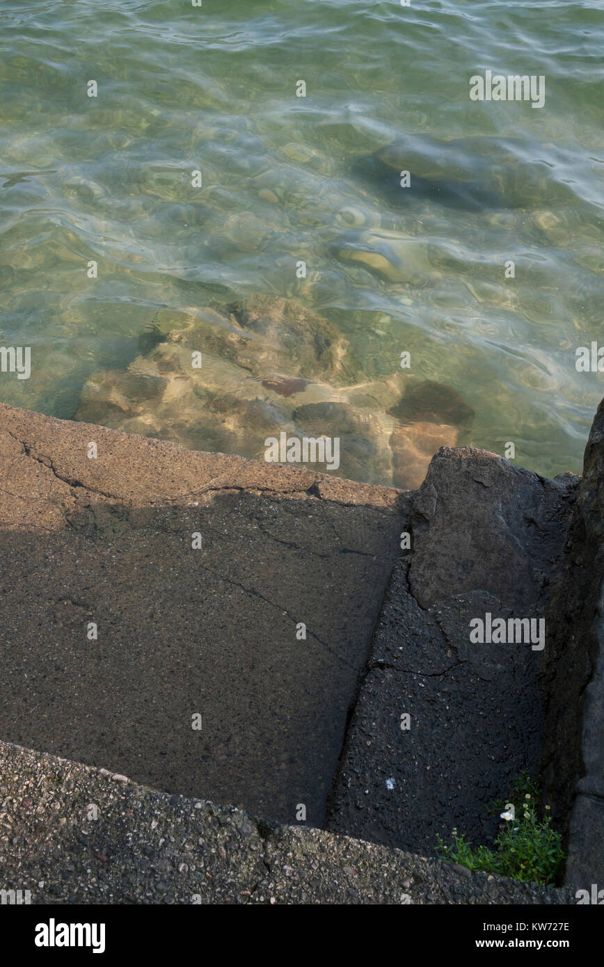 Water lapping at the steps at the side of Lake Iseo in Italy Stock ...