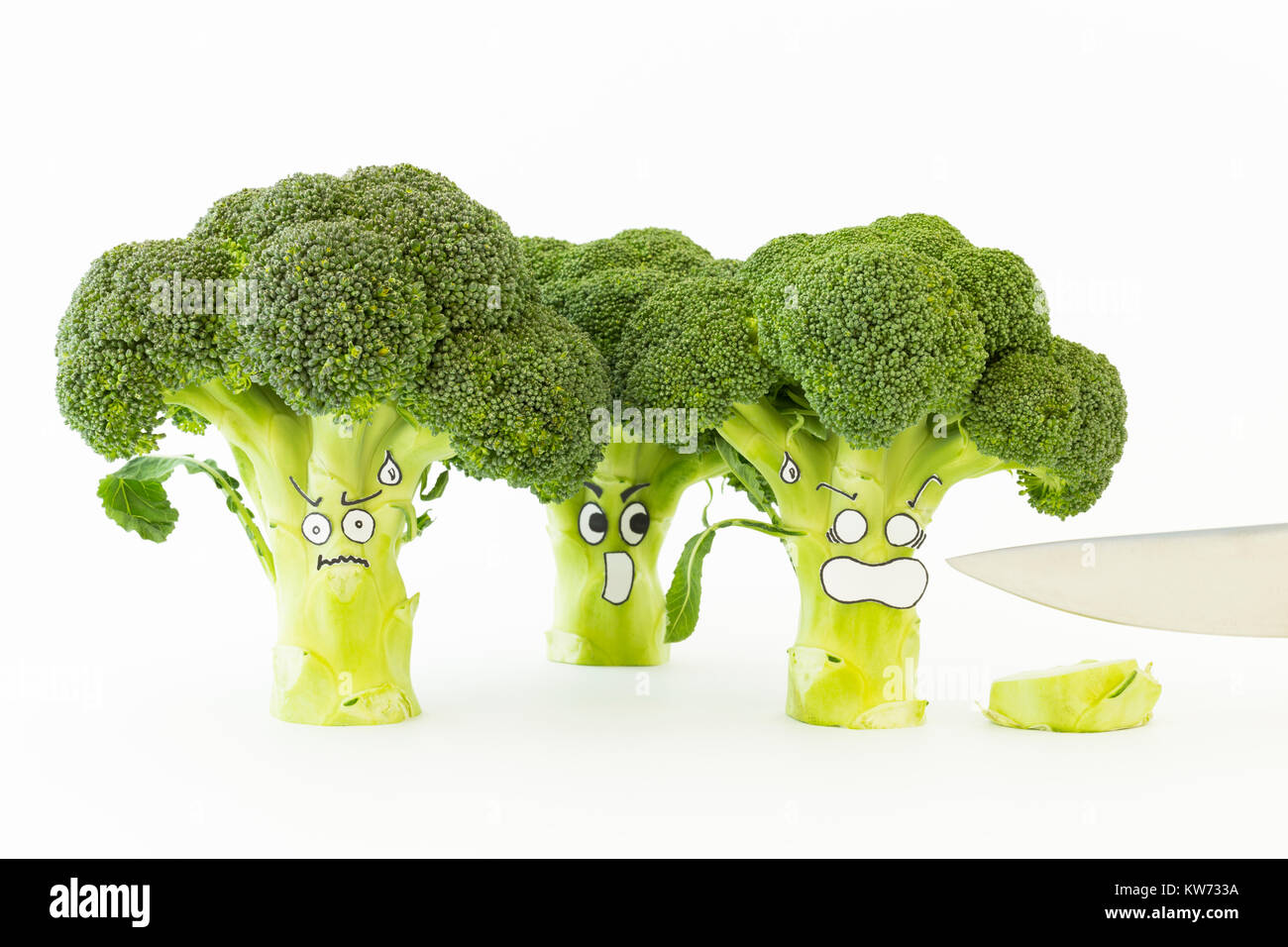 Closeup of fresh green broccoli with scared cartoon style face and a ...