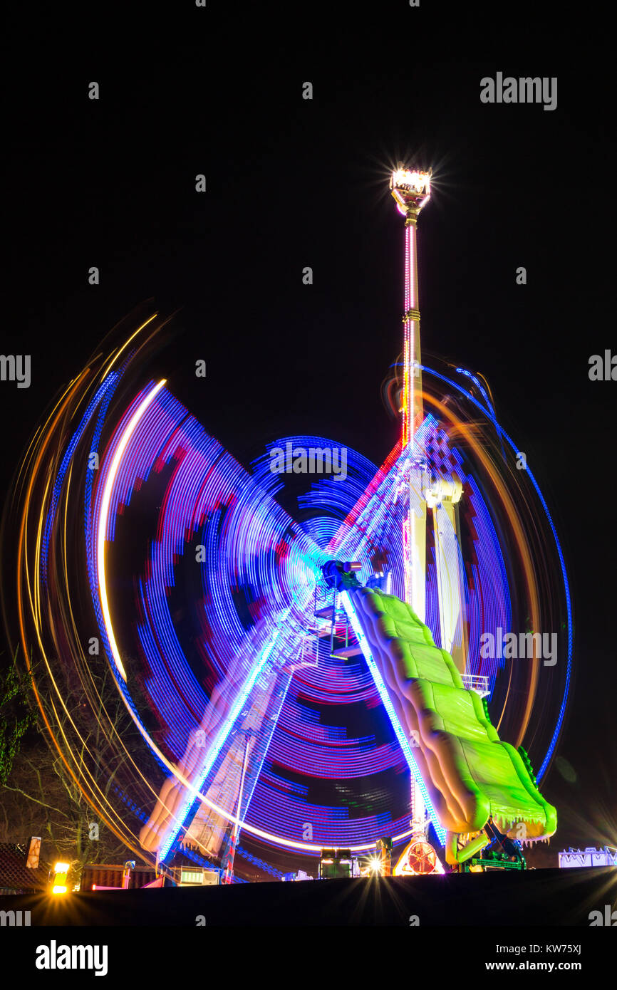 Trails of light from spinning rides at Winter Wonderland in Londons ...