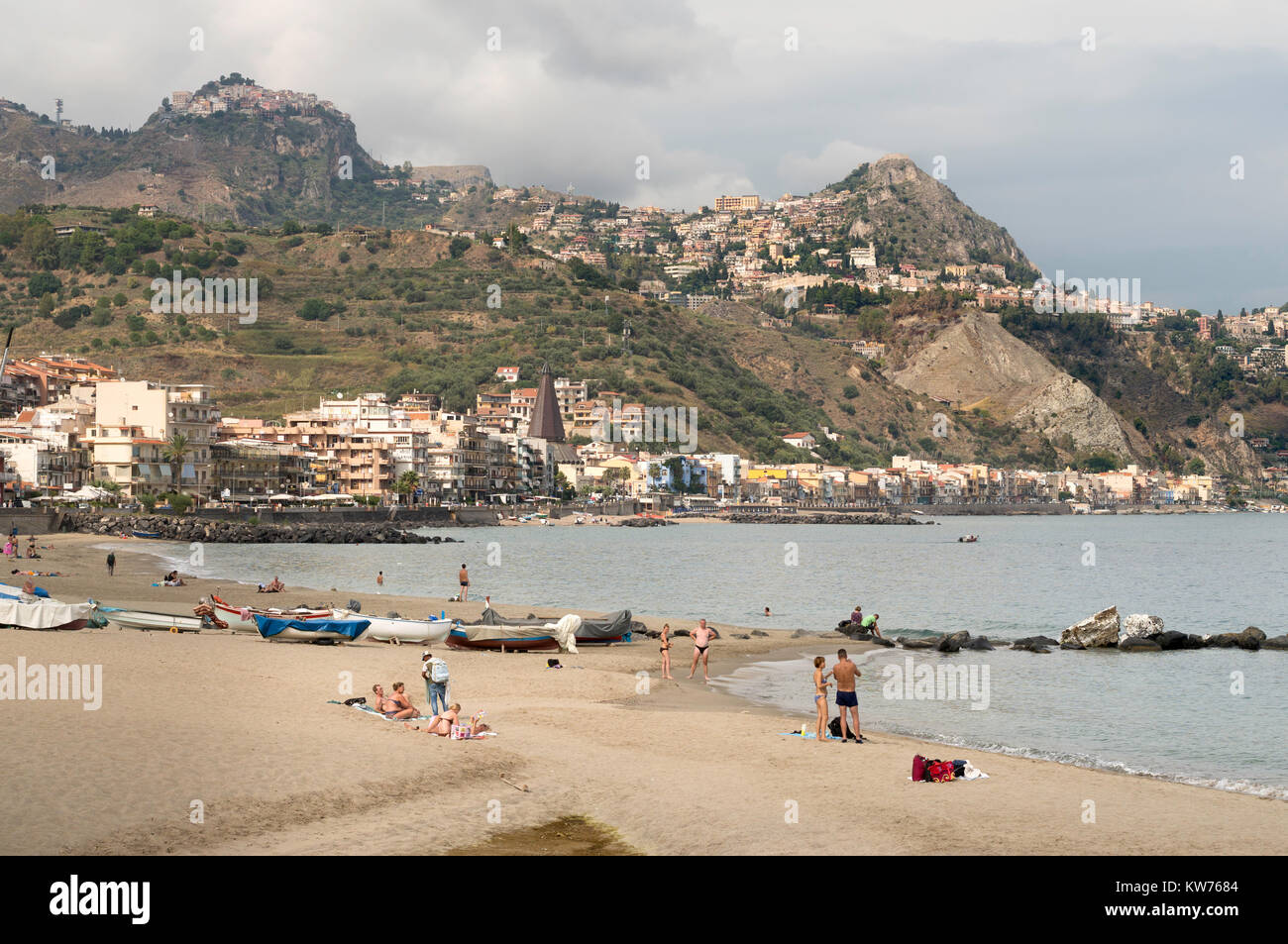 View towards Taormina from Giardini Naxos, Sicily, Europe Stock Photo ...