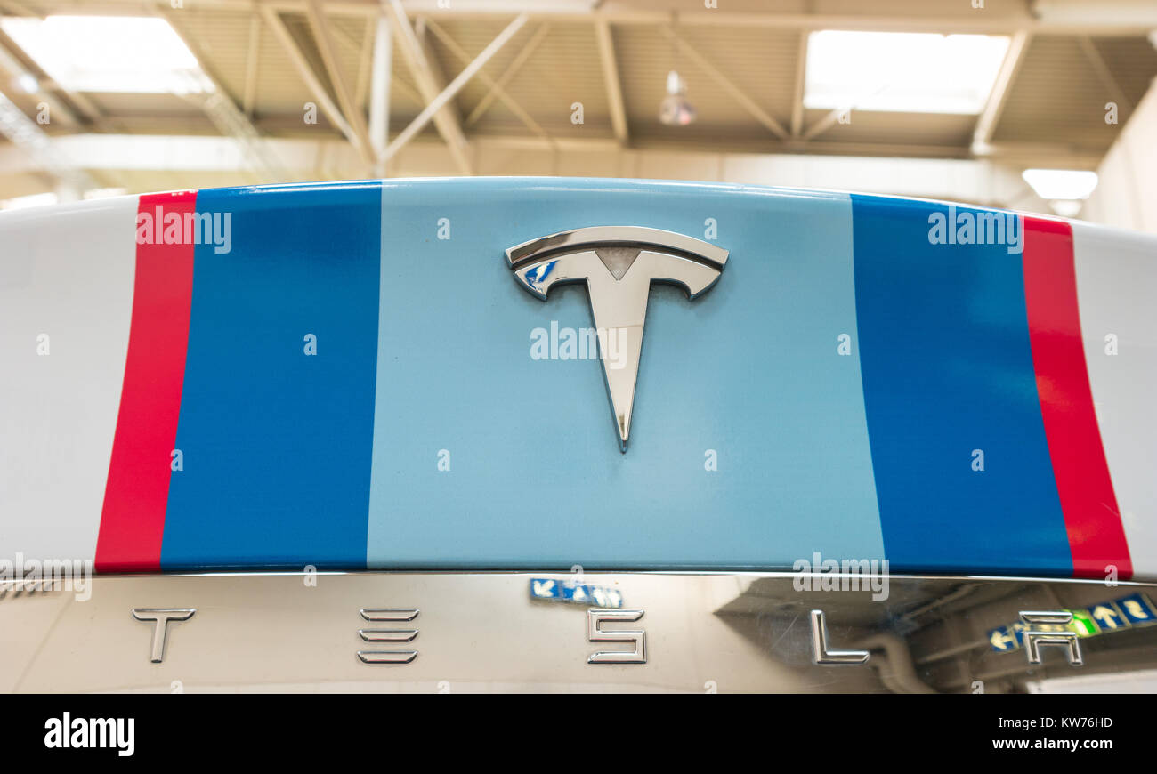 Close-up of a Tesla Logo on a car. Tesla Motors, Inc. is an American ...