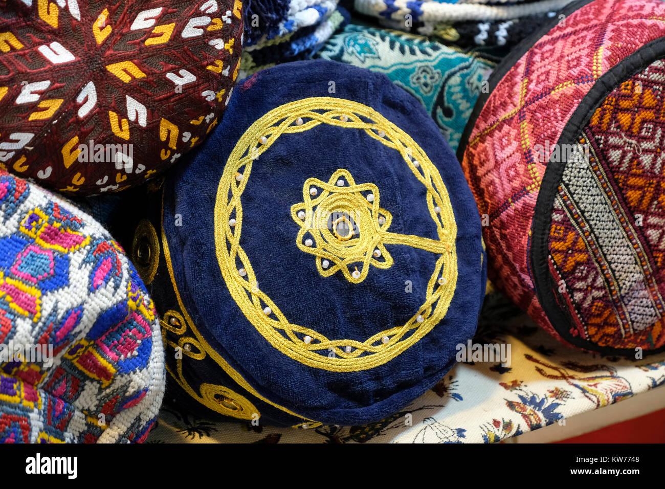 Stack of Tubeteika or Tubatay traditional richly embroidered caps worn ...