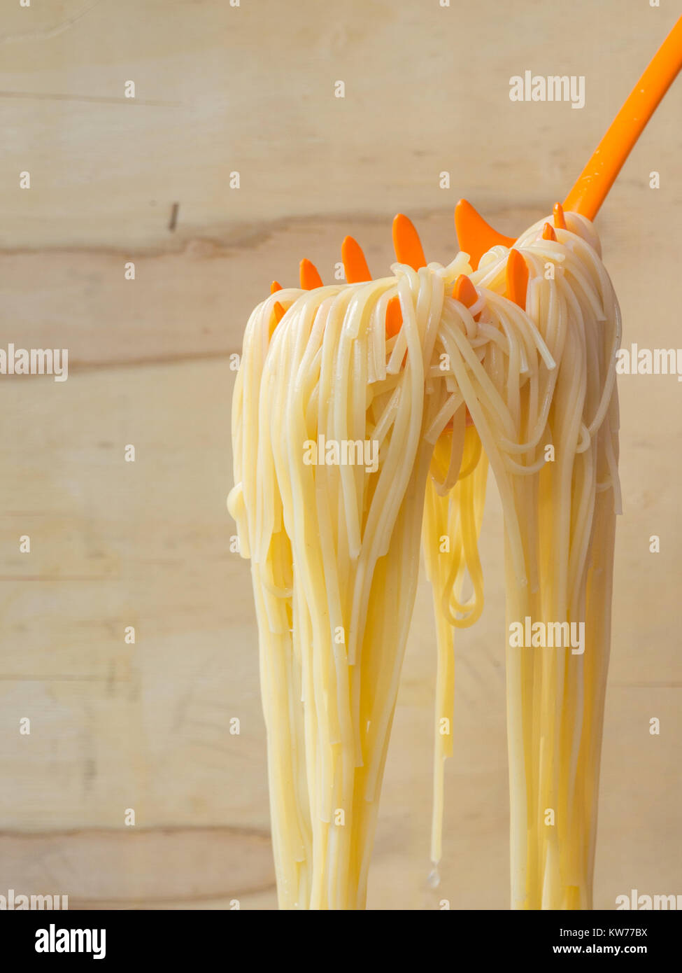 Boiled pasta spaghetti on Spaghetti spatula Stock Photo - Alamy