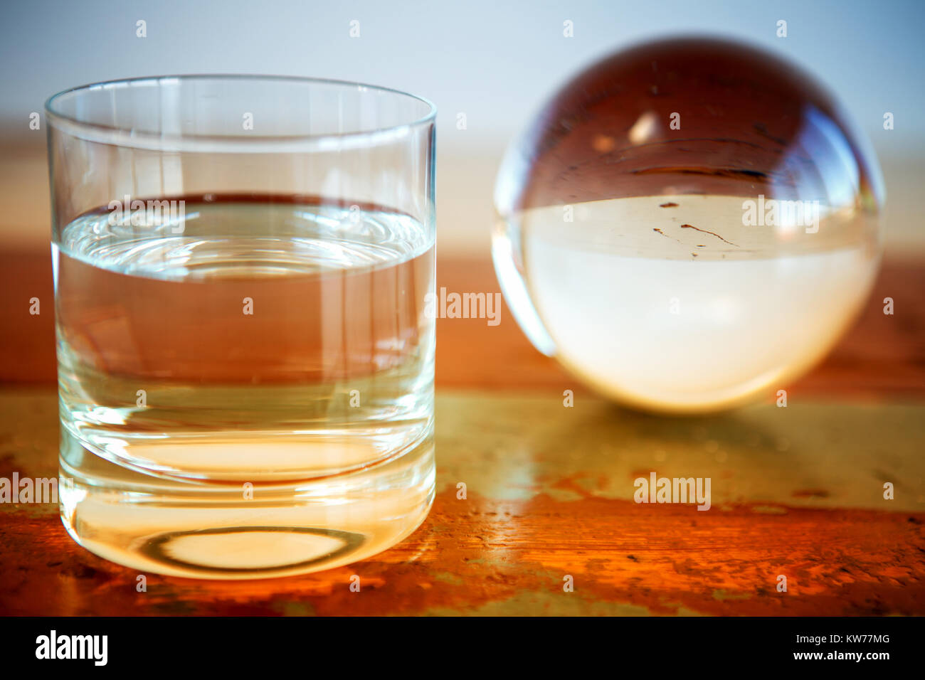close up of glass of water and a glass sphere Stock Photo - Alamy