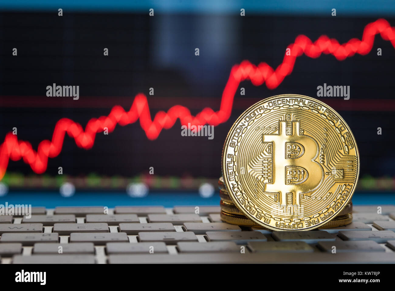 Gold Bitcoin on the background of the chart Stock Photo - Alamy