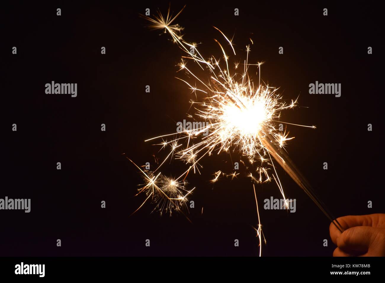 popular Hand firework with sparkler Stock Photo - Alamy