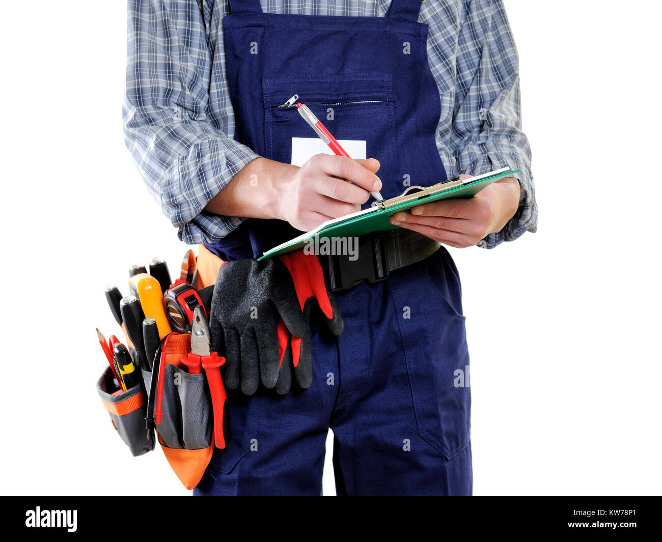Young electrician technician takes notes on notepad, isolated on white ...