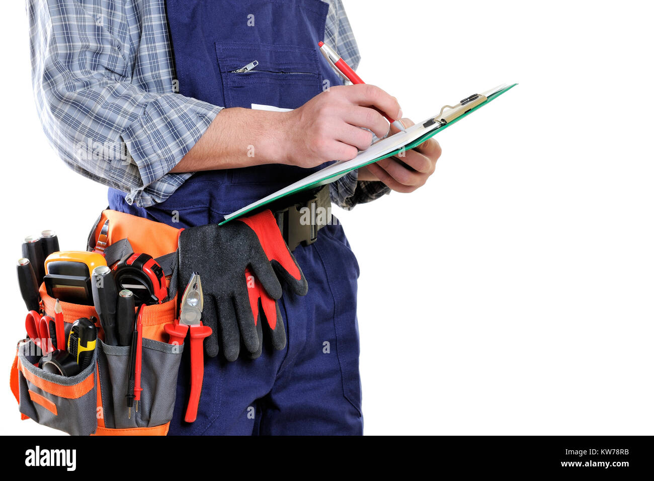 Young electrician technician takes notes on notepad, isolated on white ...