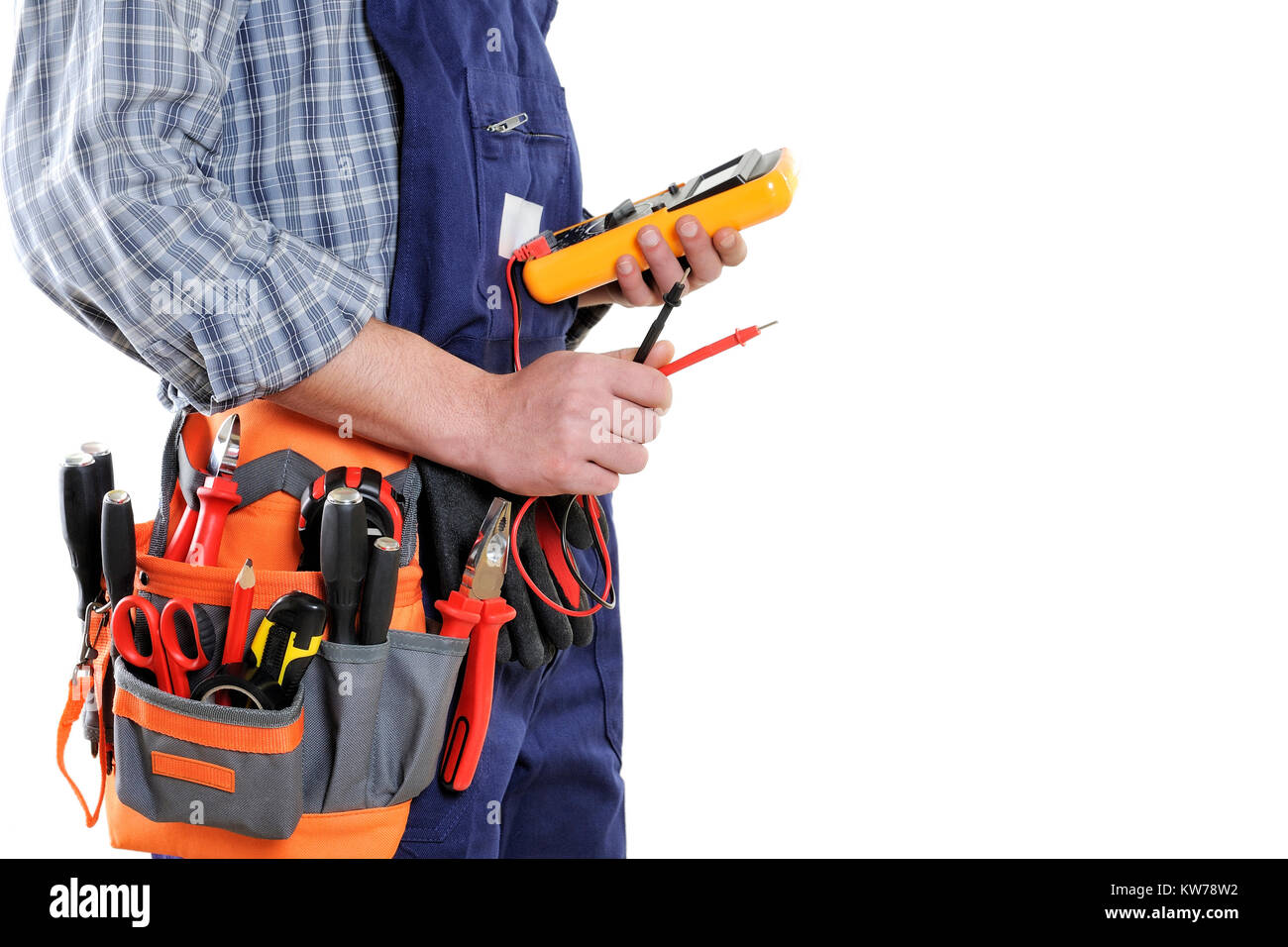 Young electrician technician with multimeter in hand to measure the ...