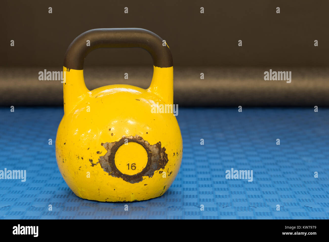 Big old and used yellow girya. Workout equipment Stock Photo - Alamy