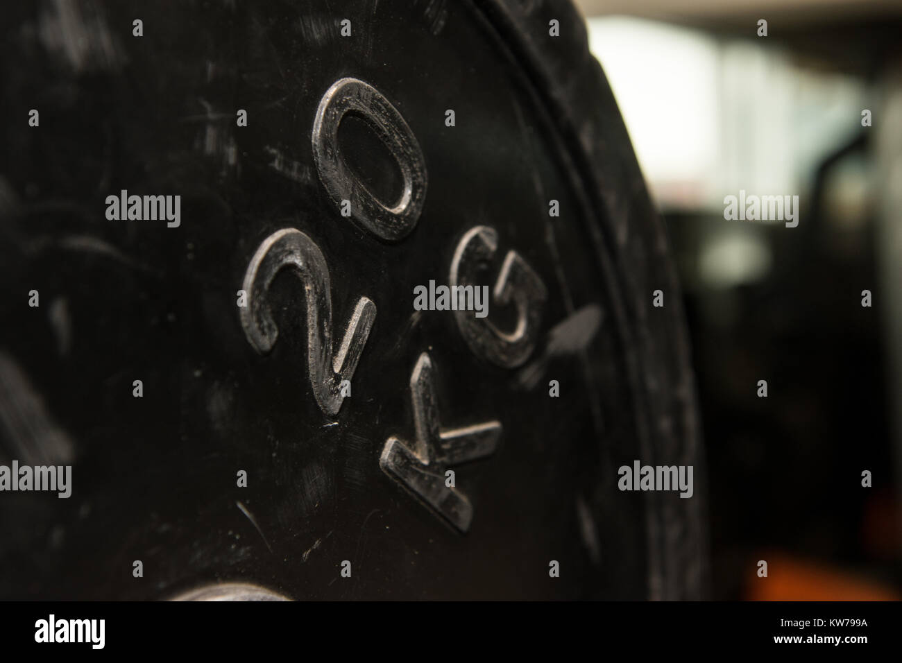 Twenty kilograms round weight in a gym. Workout equipment Stock Photo ...