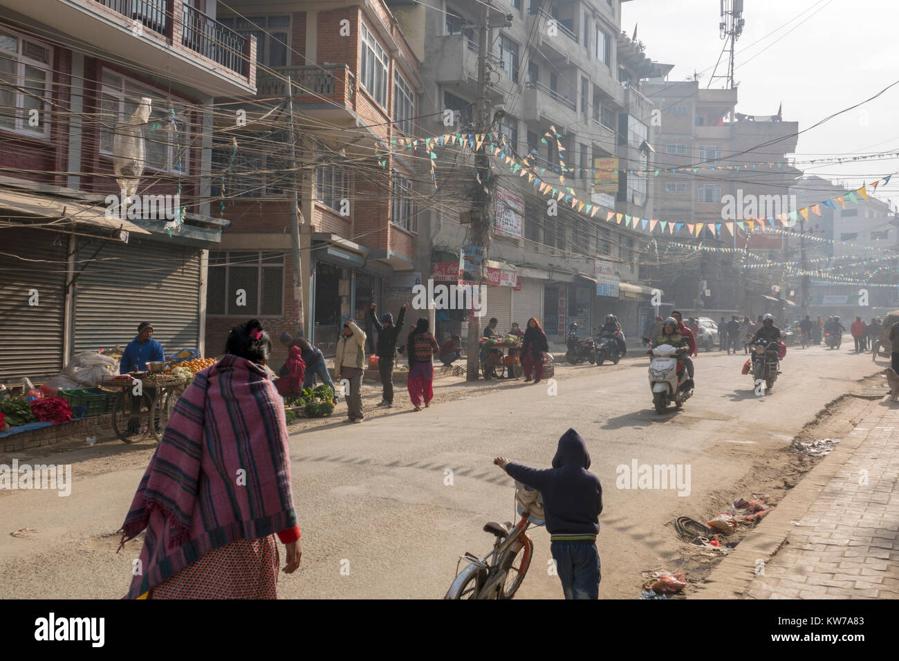 People in cold dusty streets of wintertime Kathmandu, Nepal Stock Photo ...